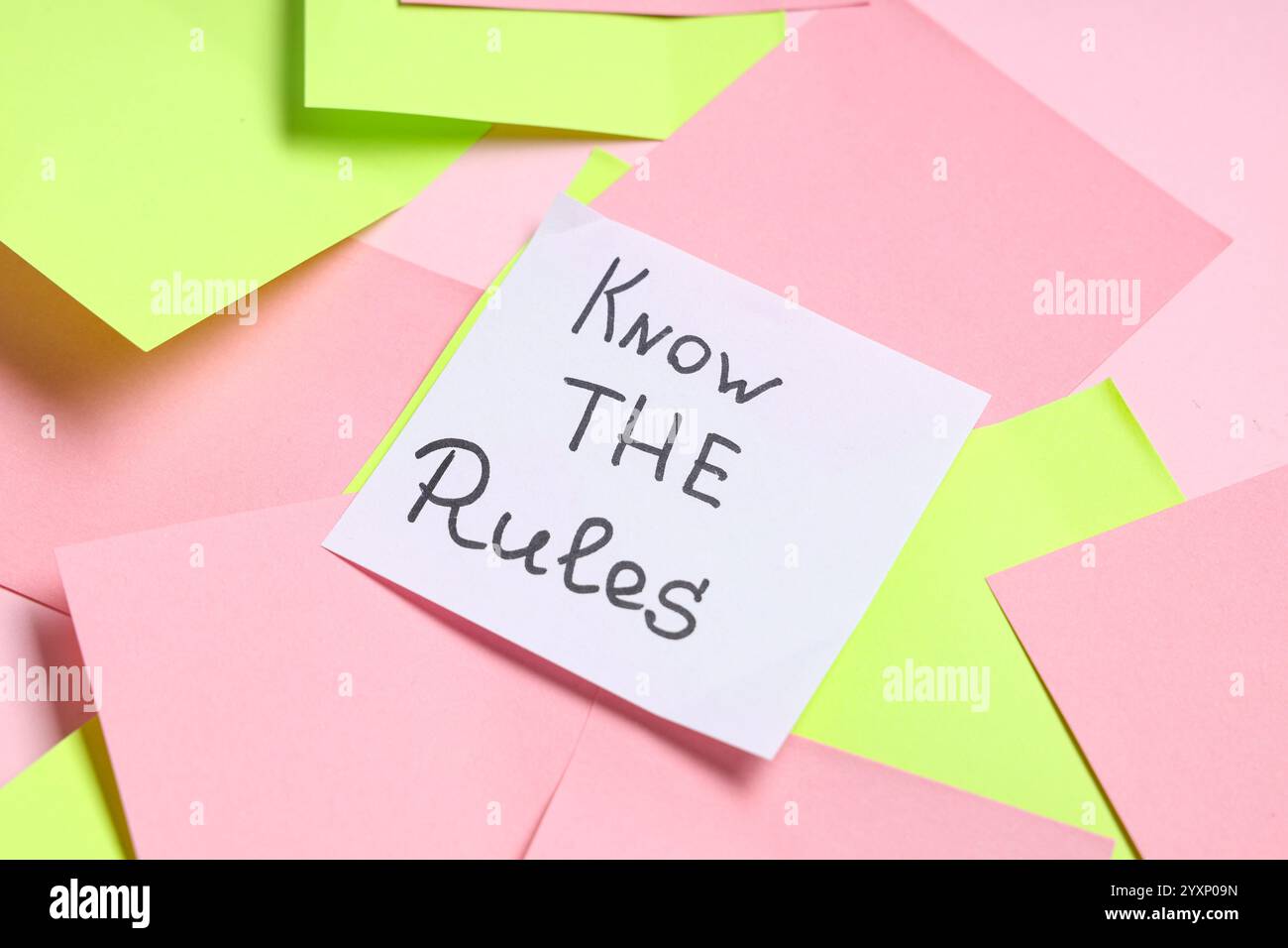 Sticky notes with text KNOW THE RULES on pink background Stock Photo ...