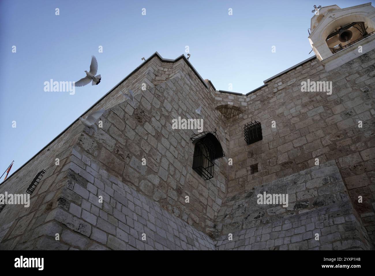 A bird flies from the Church of the Nativity, where Christians believe ...
