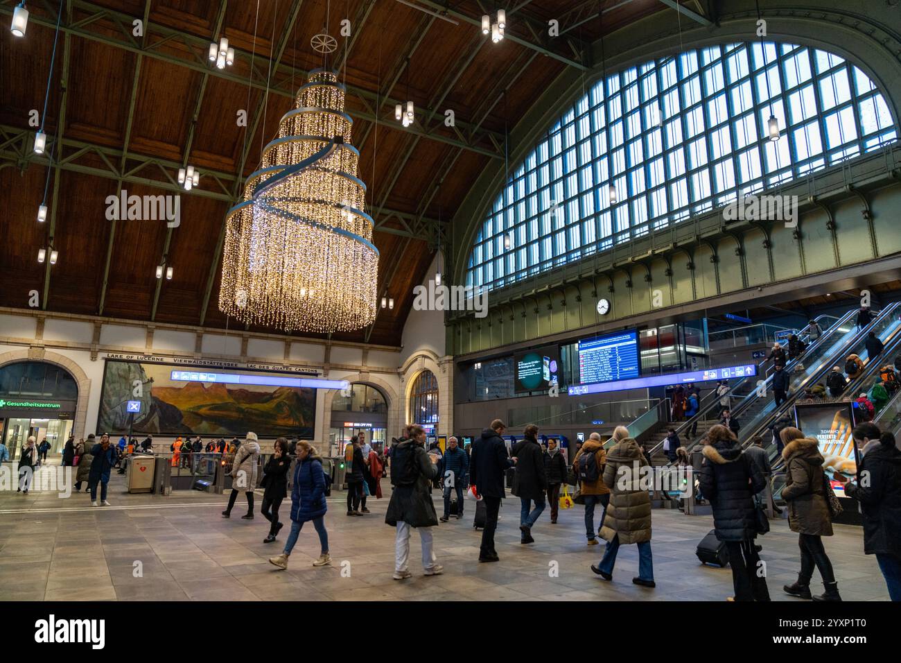Basel, Switzerland - December 6, 2024: Busy Basel SBB train station decorated for Christmas ...