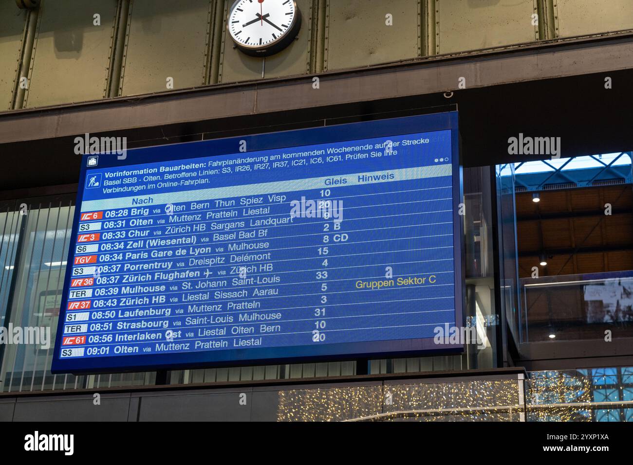 Basel, Switzerland - December 6, 2024: Busy Basel SBB train station - departure board with gate ...