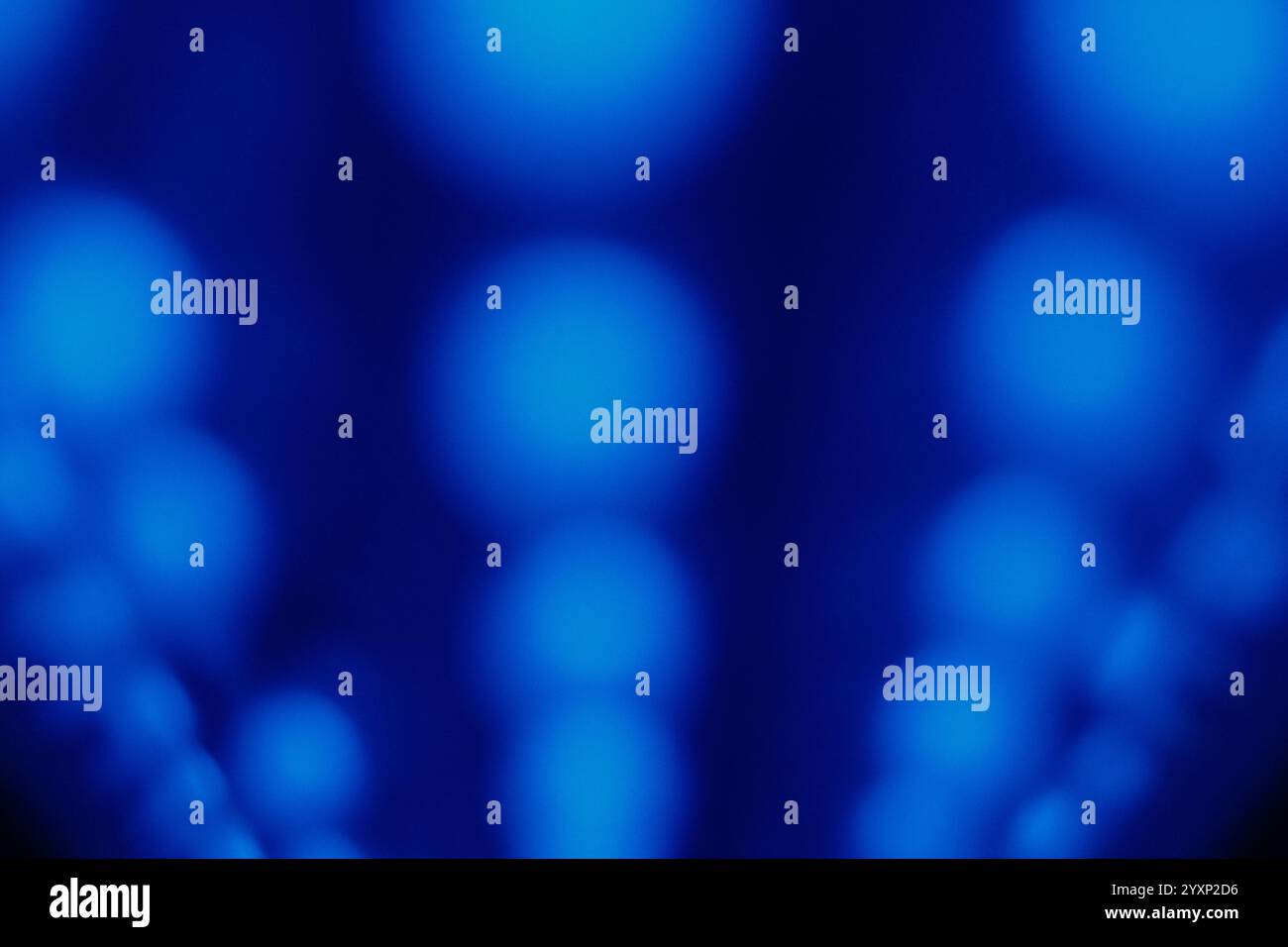 A blue background with many small blue circles. The circles are all ...