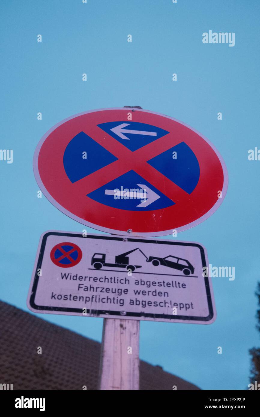 A sign with a red circle and two arrows pointing to the right. The sign ...