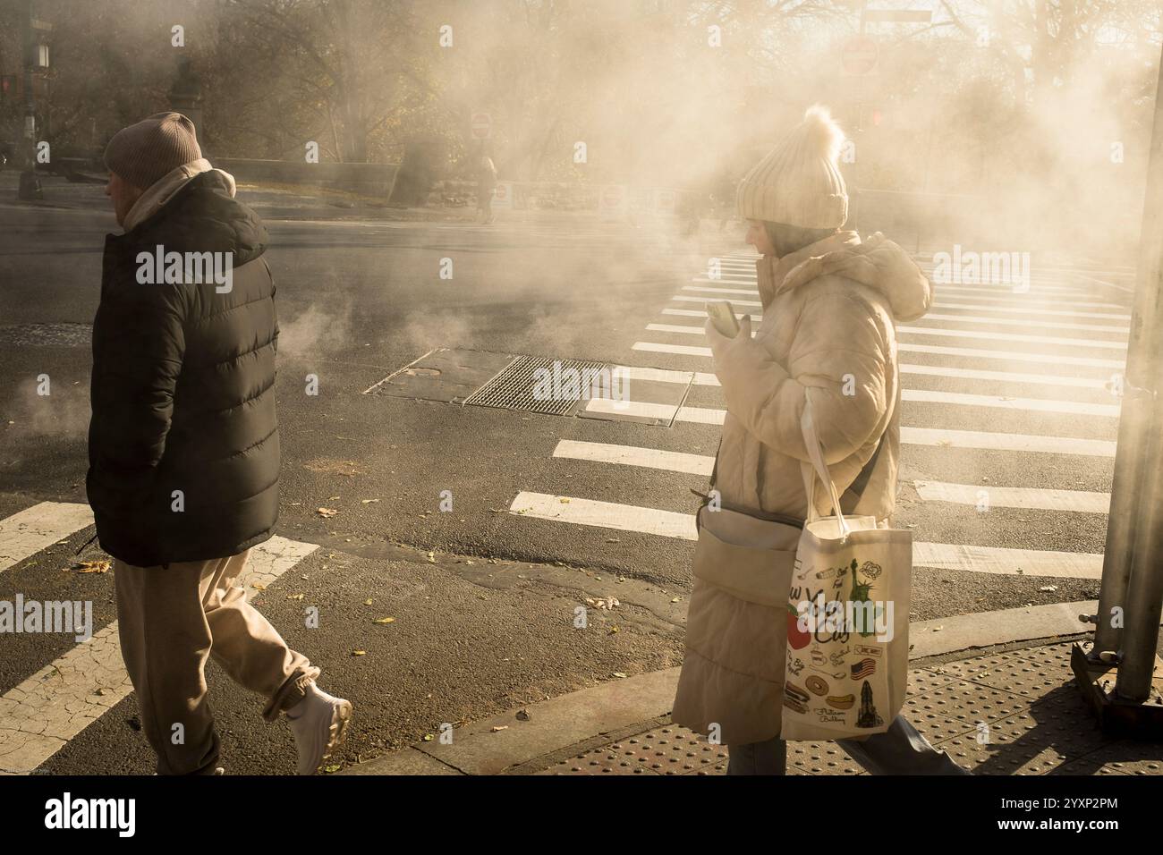 New York city commuters walk briskly to work on a bitterly cold morning ...