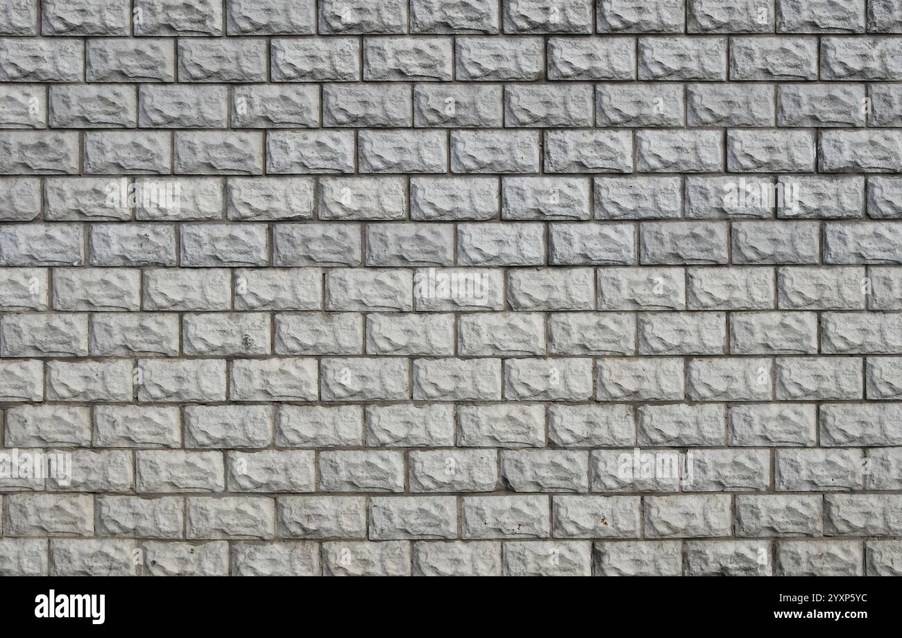 White painted brick tile wall background texture pattern; close up ...