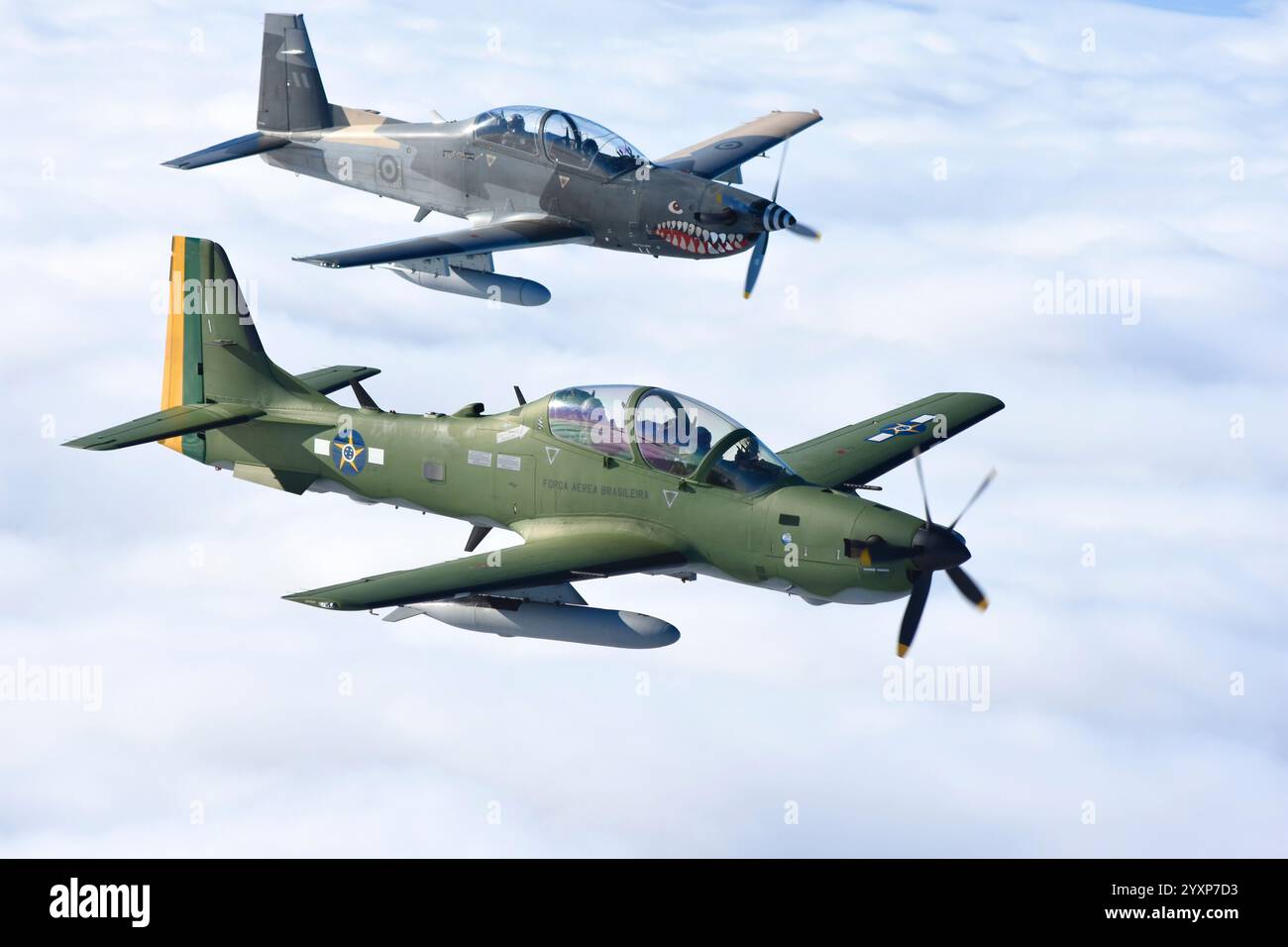 An A-29B Super Tucano of the Brazilian Air Force leads a Peruvian Air ...