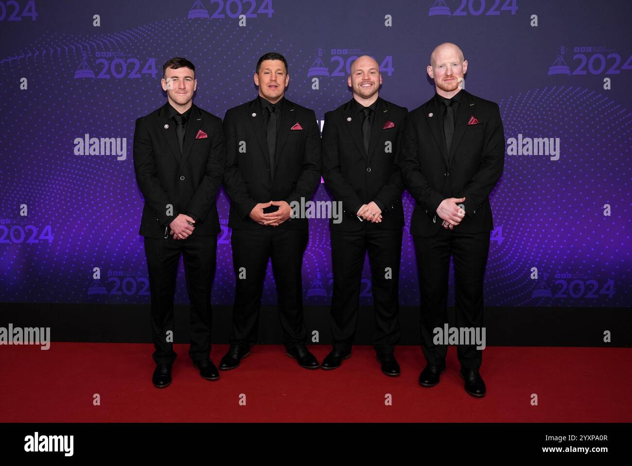 Wigan Warriors' Harry Smith, head coach Matt Peet, Liam Marshall and ...