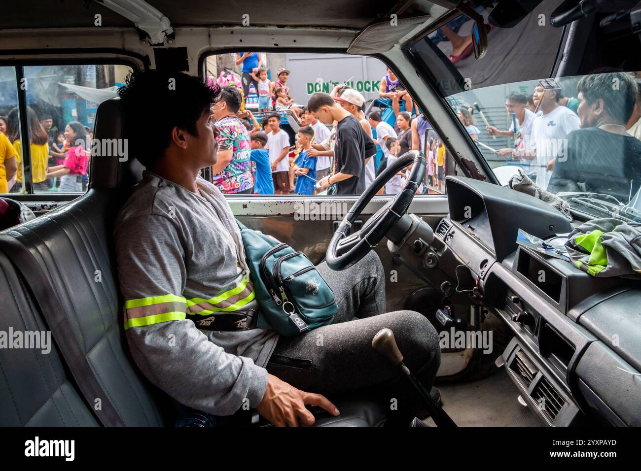 A Catholic religious parade passes by during an annual parade in the ...
