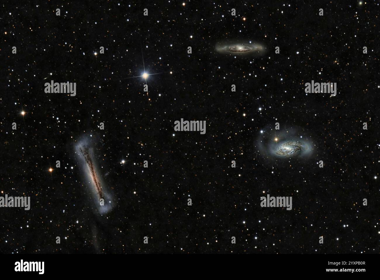 The Leo Triplet, consisting of spiral galaxies Messier 65, Messier 66 ...