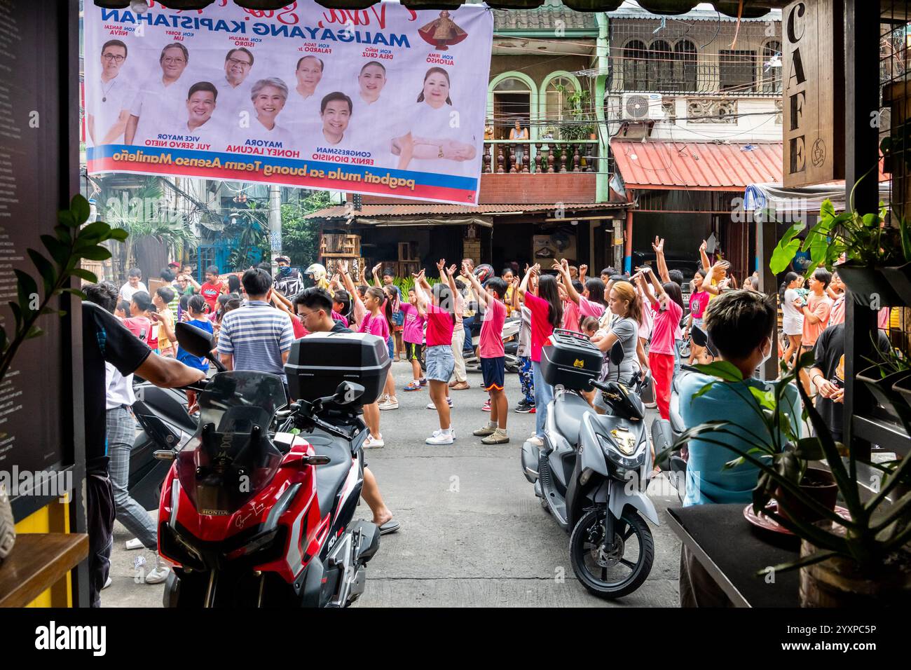 A Catholic religious parade passes by a house during an annual parade ...