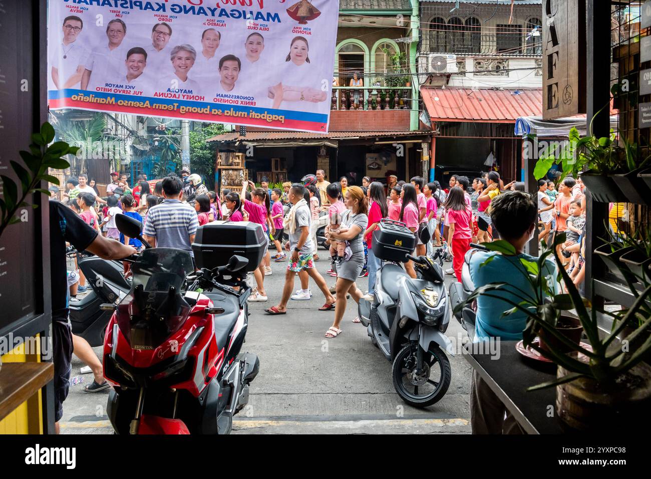 A Catholic religious parade passes by a house during an annual parade ...