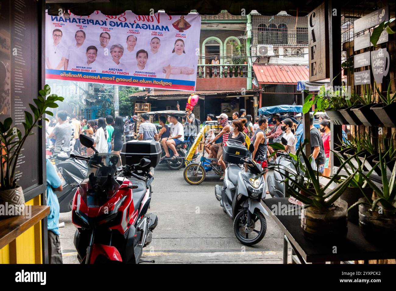 A Catholic religious parade passes by a house during an annual parade ...