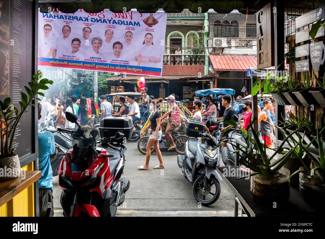 A Catholic religious parade passes by a house during an annual parade ...