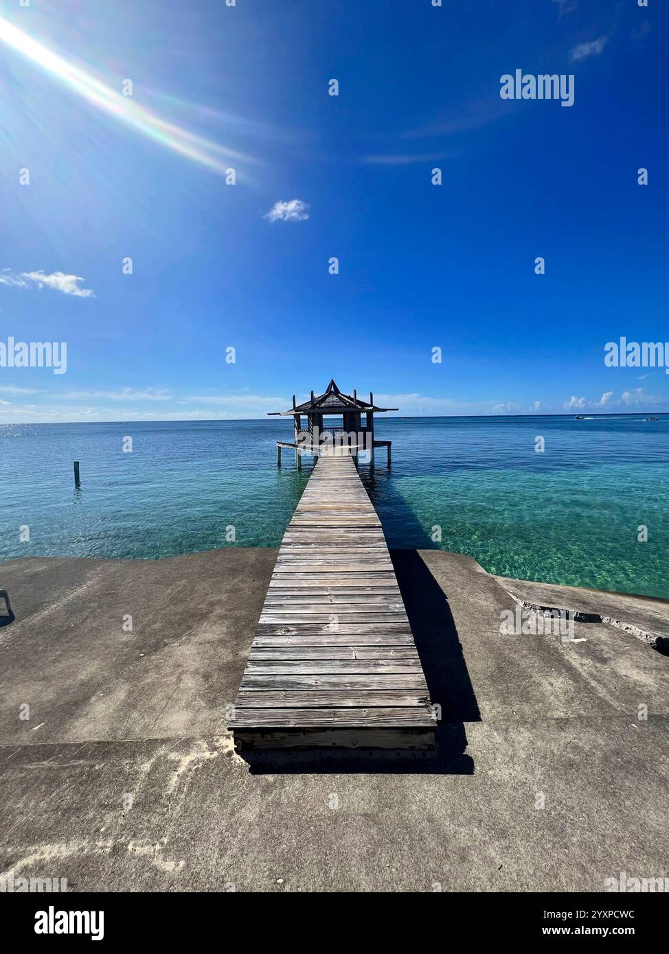 Gazebo at the end of an empty pier on the island of Roatan, Honduras Stock Photo - Alamy