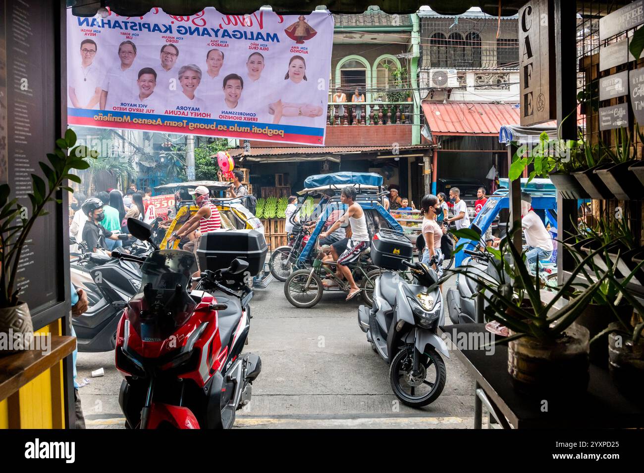 A Catholic religious parade passes by a house during an annual parade ...