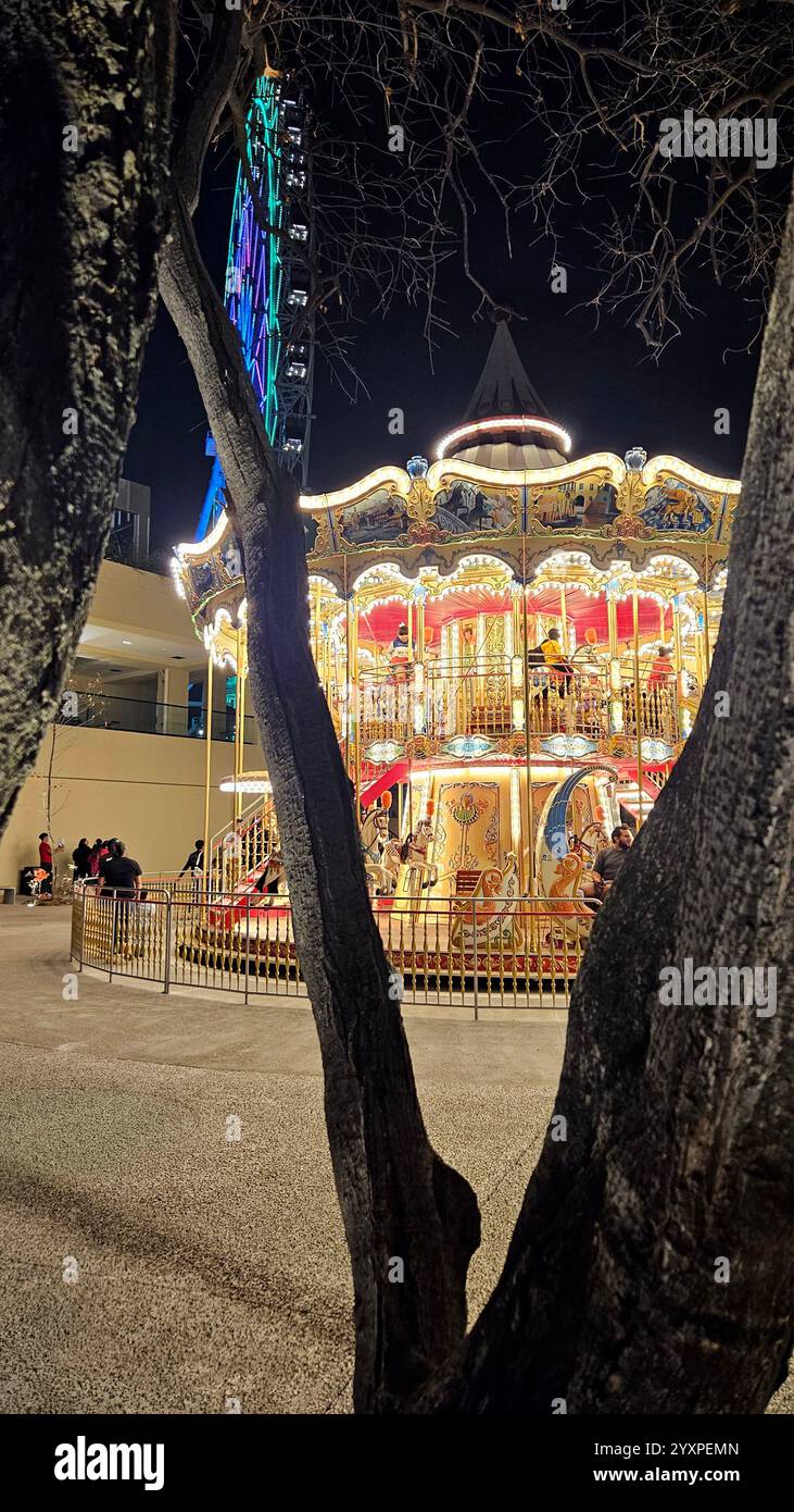 Mexico City, Mexico - Mar 20 2024: Two-story carousel with moving rides ...