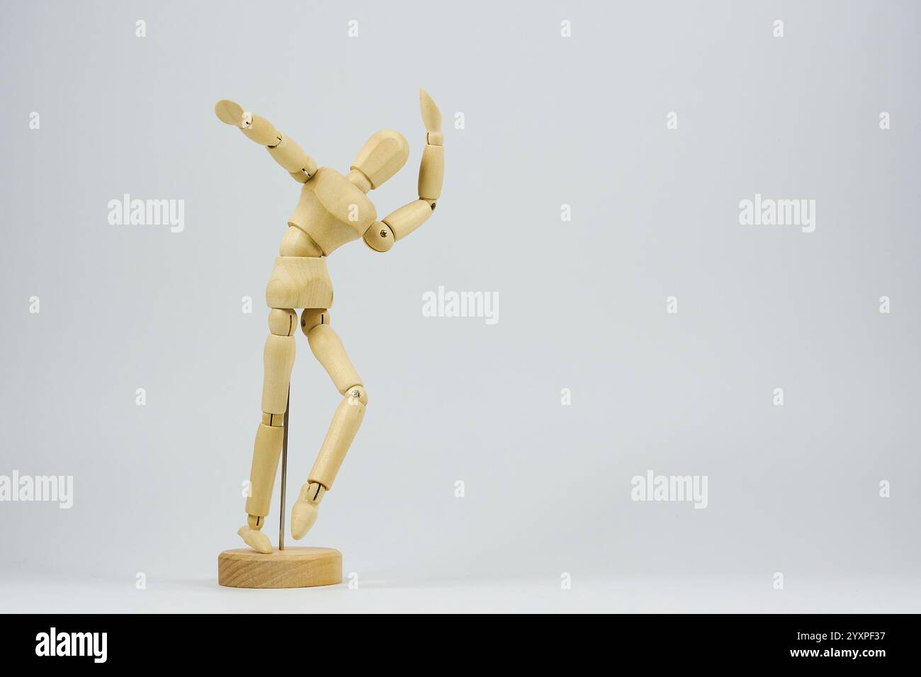 Wooden figure representing various dance movements demonstrating joy ...