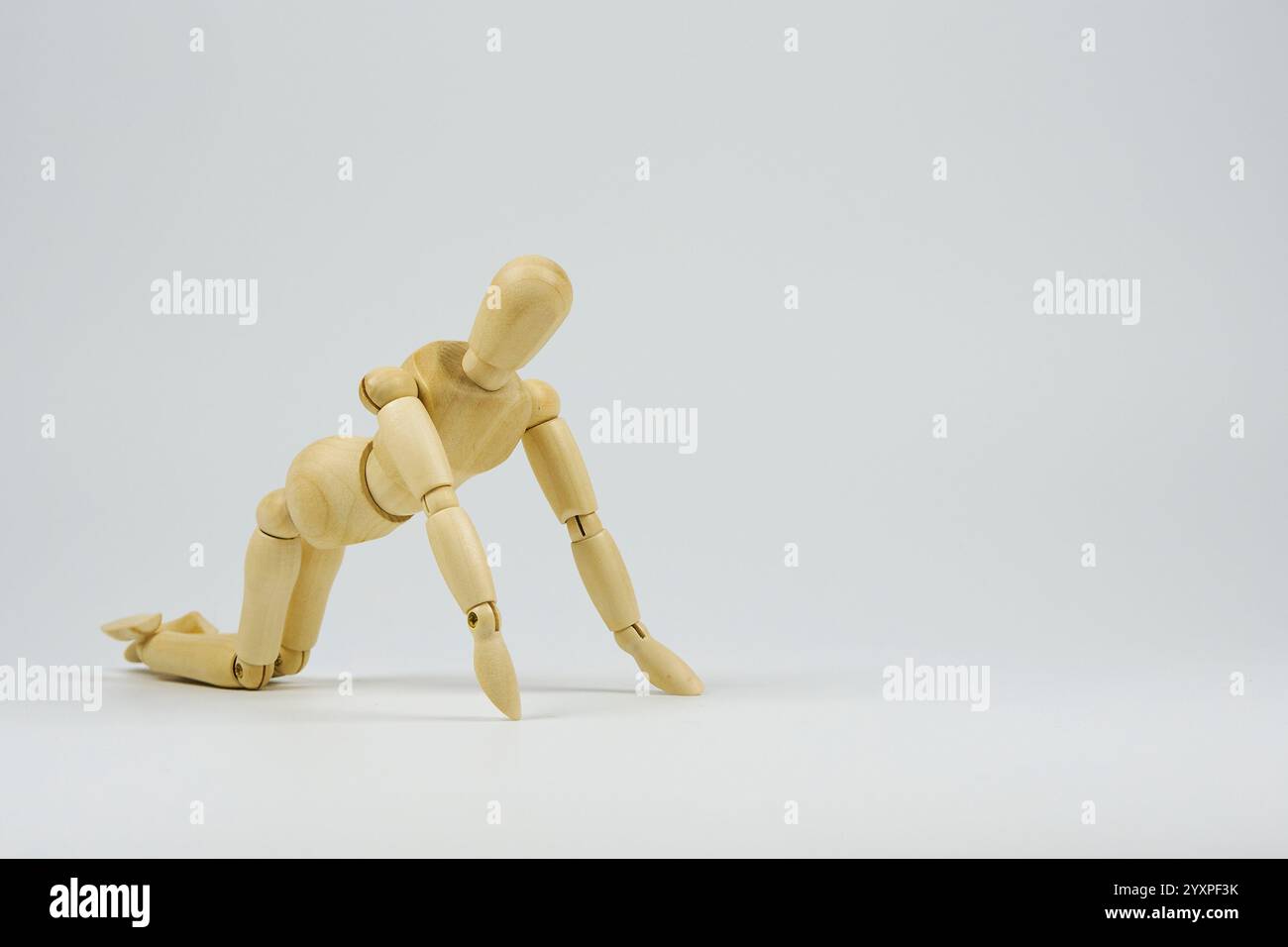 Articulated wooden figure representing the position of some type of ...