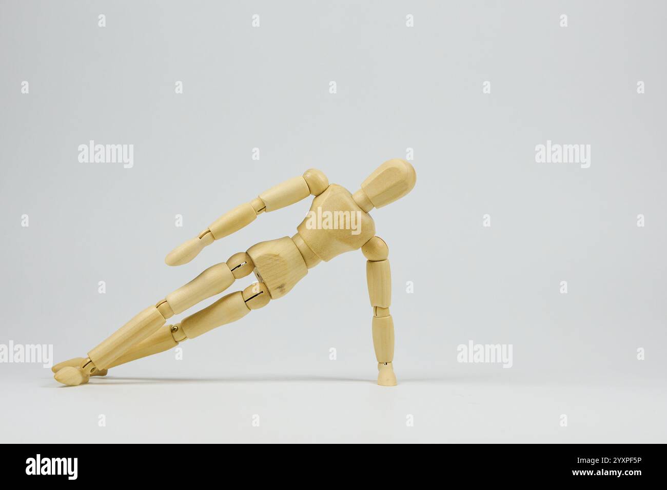 Articulated wooden figure representing the position of some type of ...