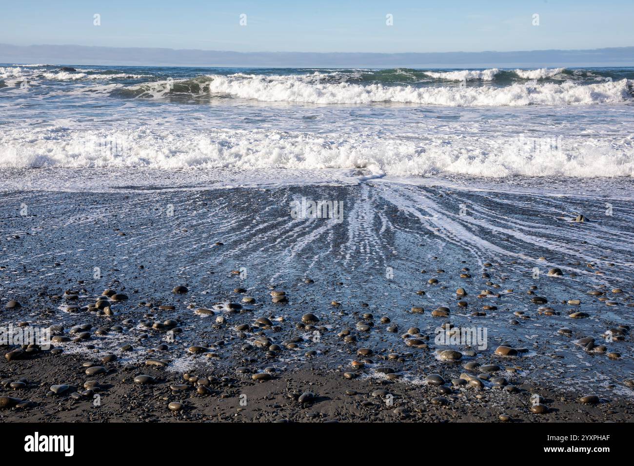 WA28023-00...WASHINGTON - Lines of bubbles and foam on the pebbles on ...