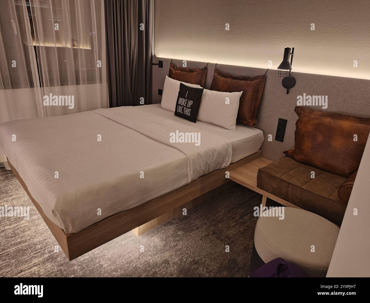 Hotel interior at night with lights on Stock Photo - Alamy