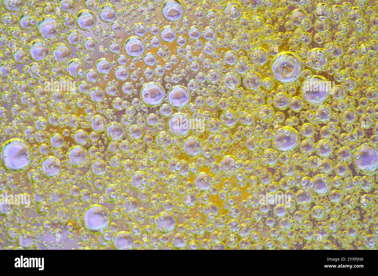 Vibrant abstract background featuring yellow bubbles with subtle purple ...