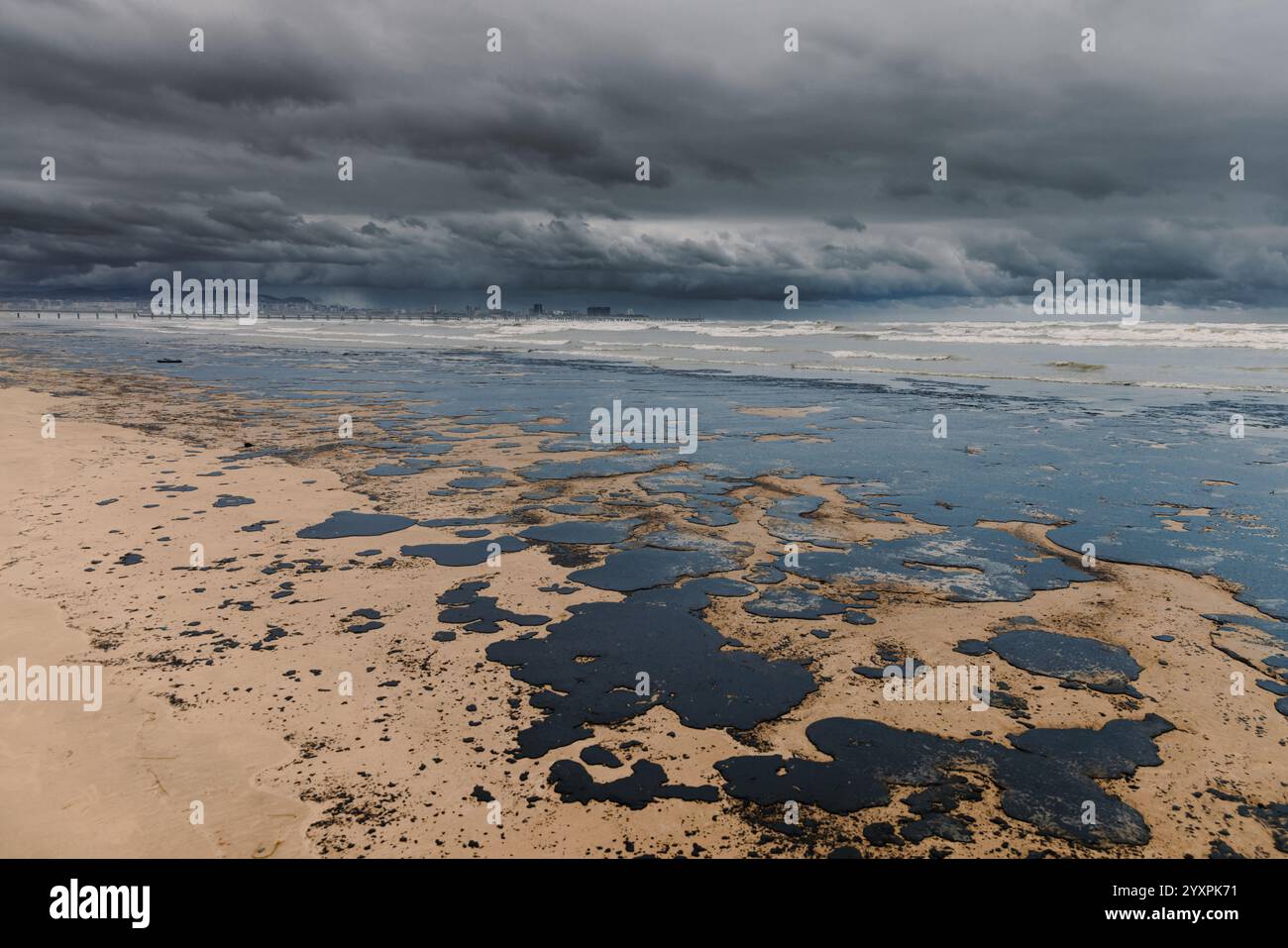 The sea and the beach are polluted with fuel oil. Beach oil spill ...