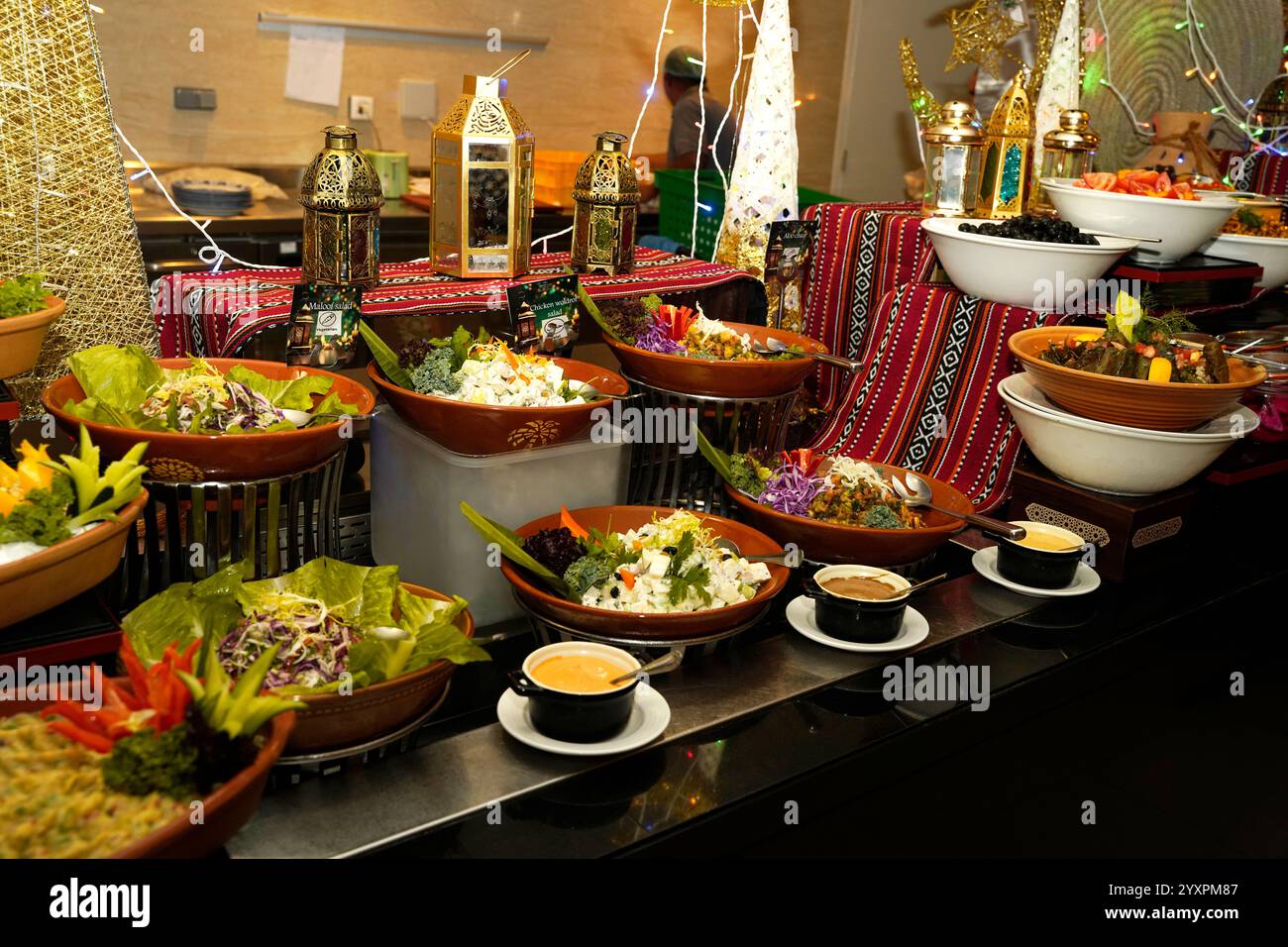 Vibrant display of fresh salads and accompaniments elegantly arranged ...
