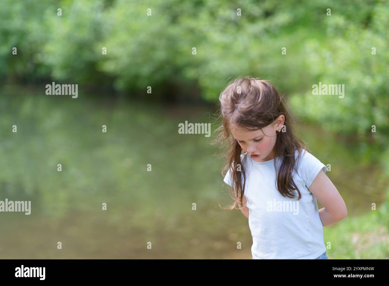 Little cute sad girl walking in summer park. Concept of sad child ...