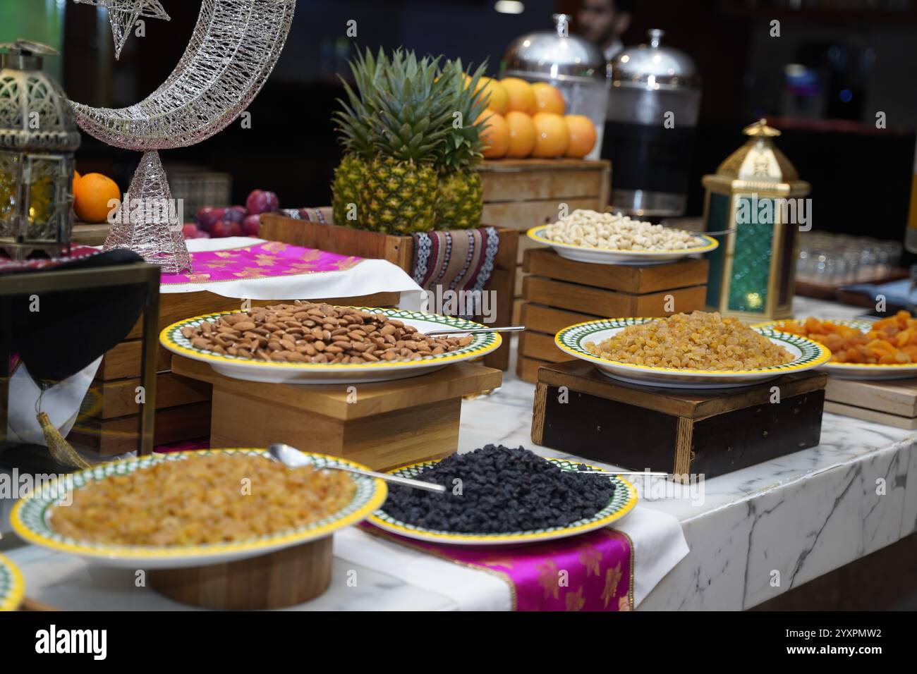 Exquisite spread featuring colorful plates of dried fruits and nuts ...