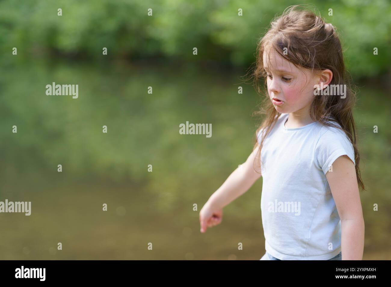 Little cute sad girl walking in summer park. Concept of sad child ...