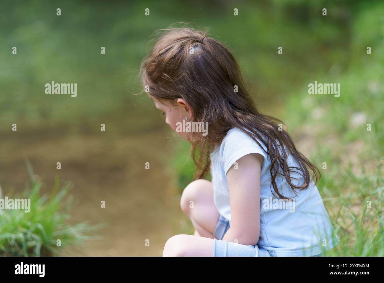 Little cute sad girl walking in summer park. Concept of sad child ...
