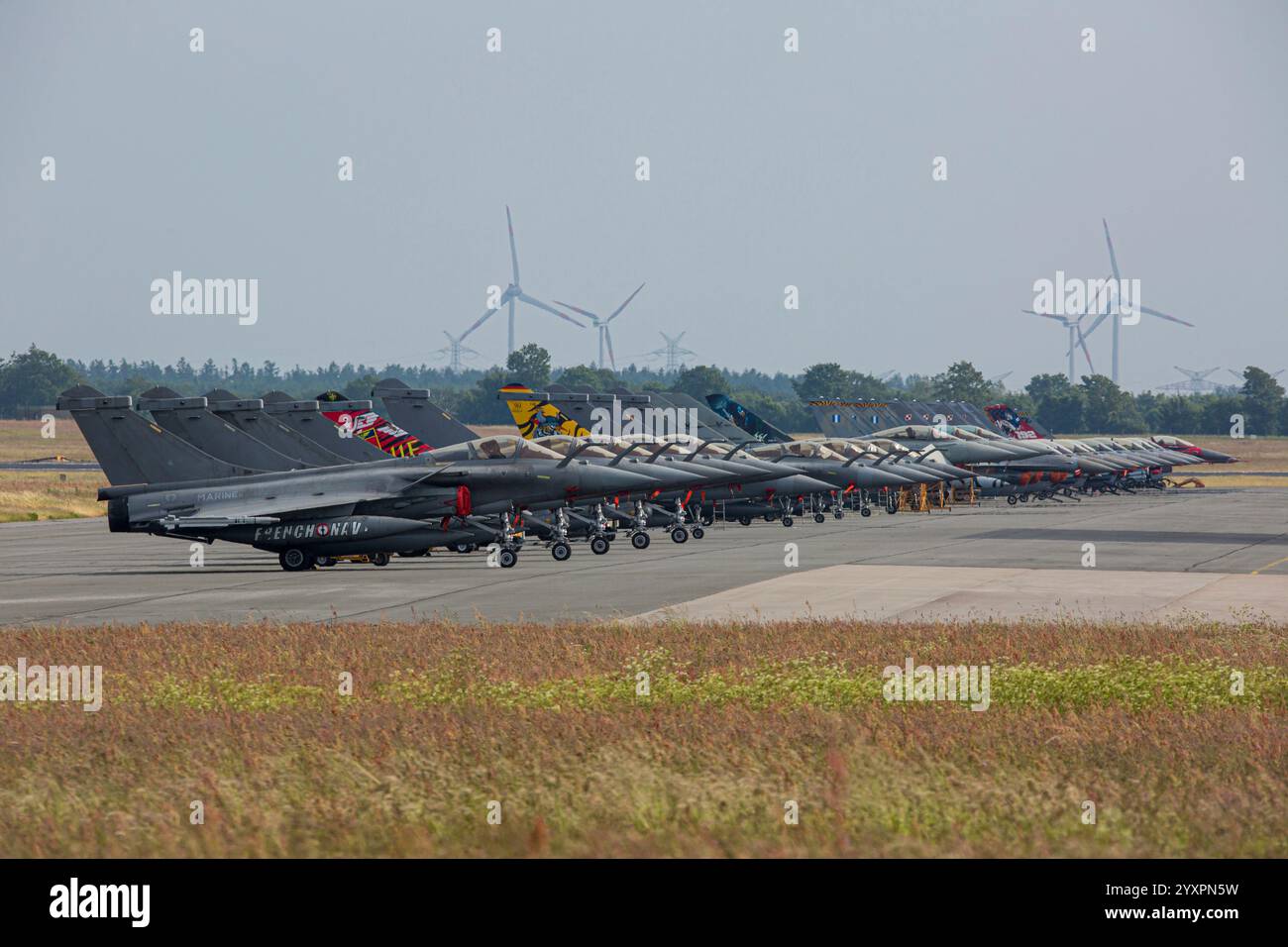 Military planes on the flight line at the NATO Tiger Meet 2024 ...
