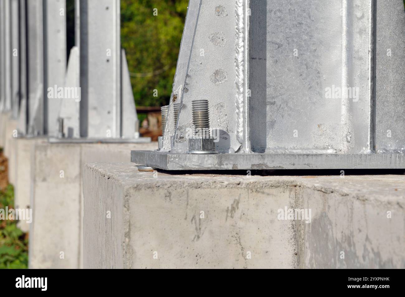 Bolted connection between metal pillars and the base of anchor bolts ...