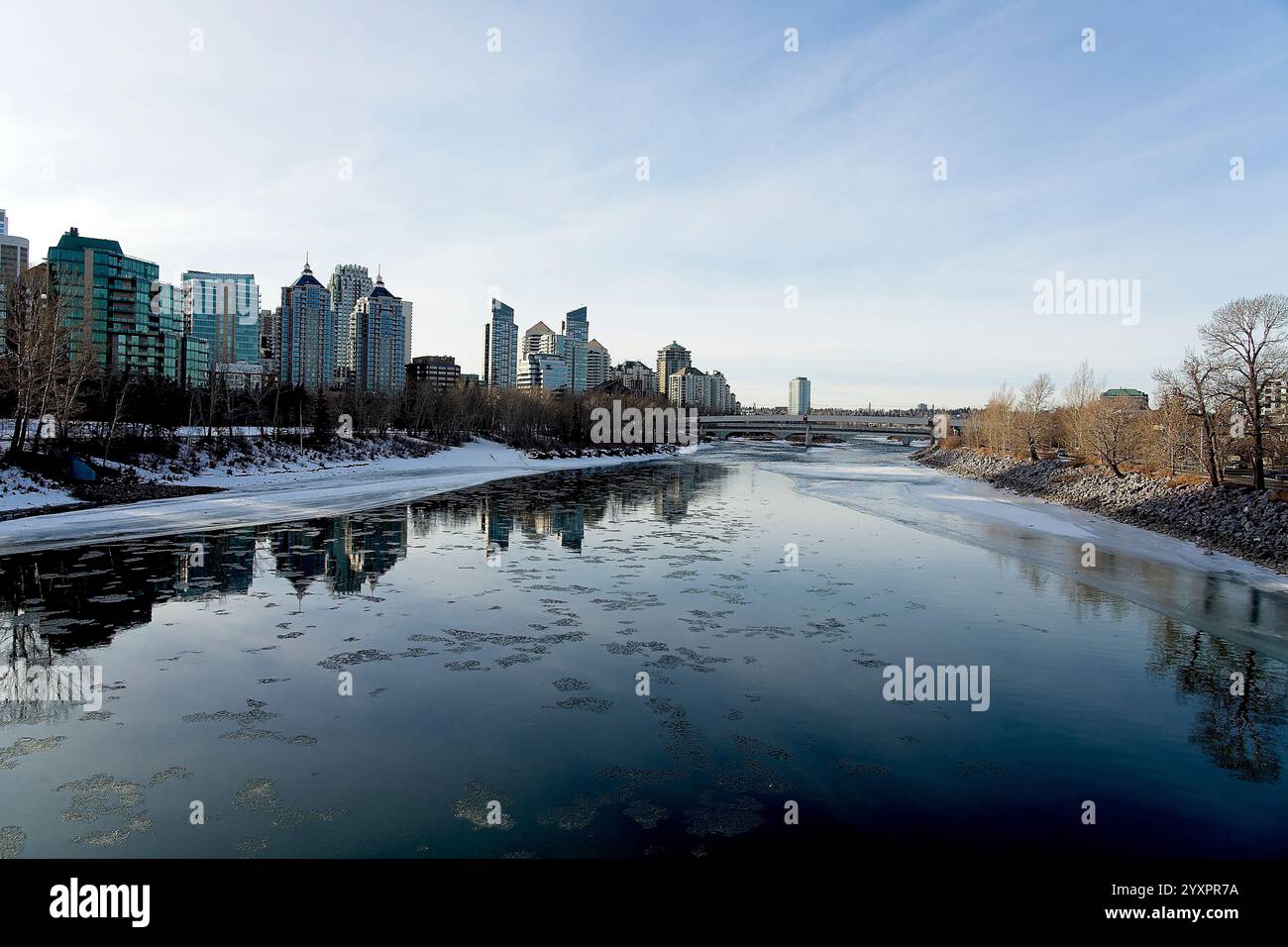 Bow river flowing through downtown Calgary in the winter with ice and ...