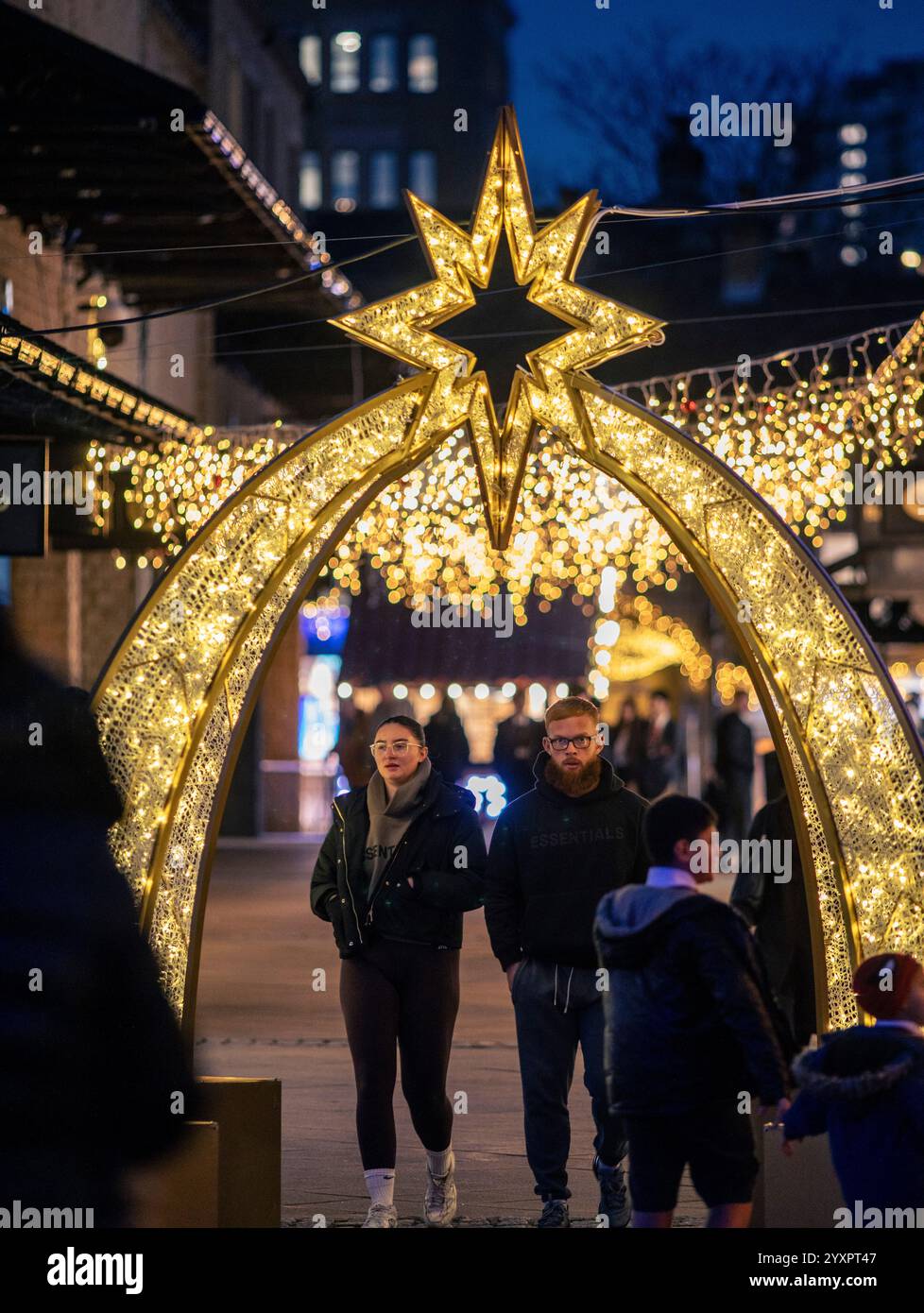 Christmas lights and shoppers in the town centre of Halifax, West ...