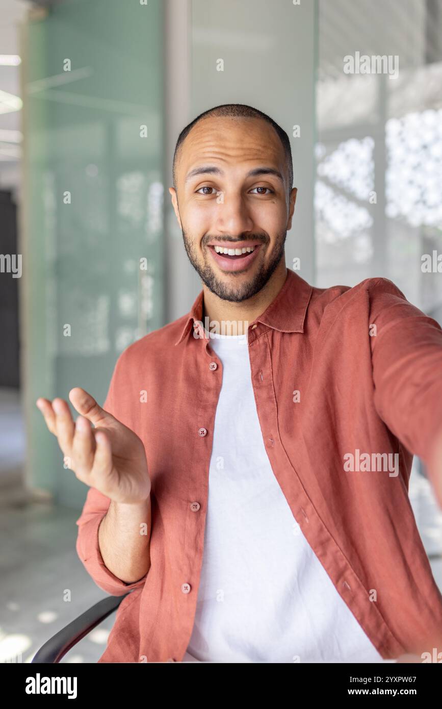 Confident individual expressing positivity while speaking online ...