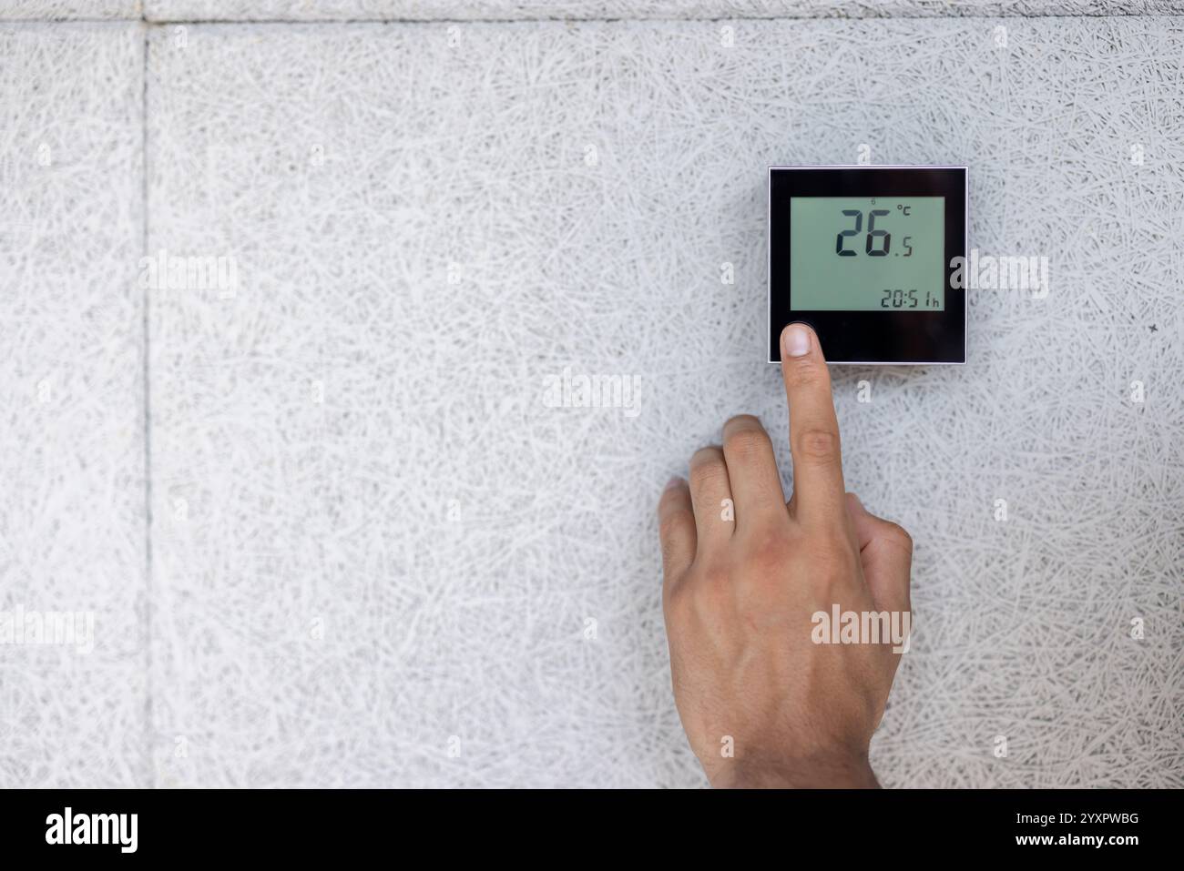 Man adjusts temperature on device hi-res stock photography and images ...
