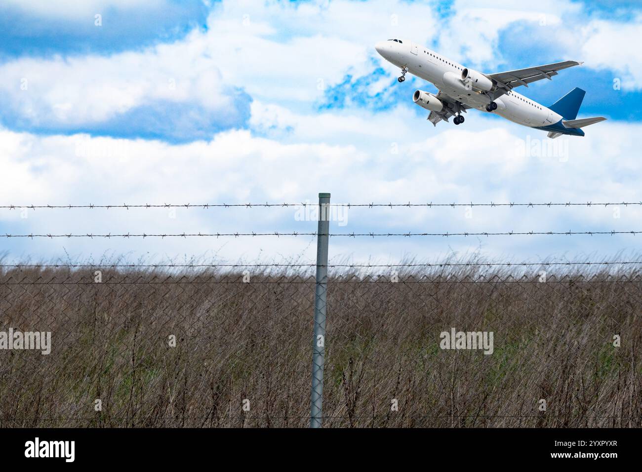 People behind barbed wire hi-res stock photography and images - Alamy
