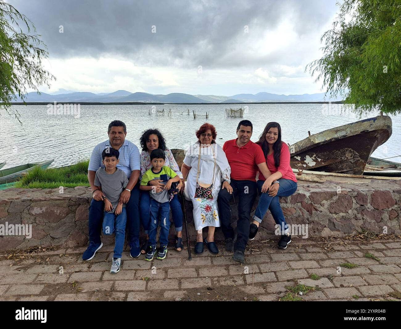Traditional Latin family with grandmother, brothers and nephews spend a ...