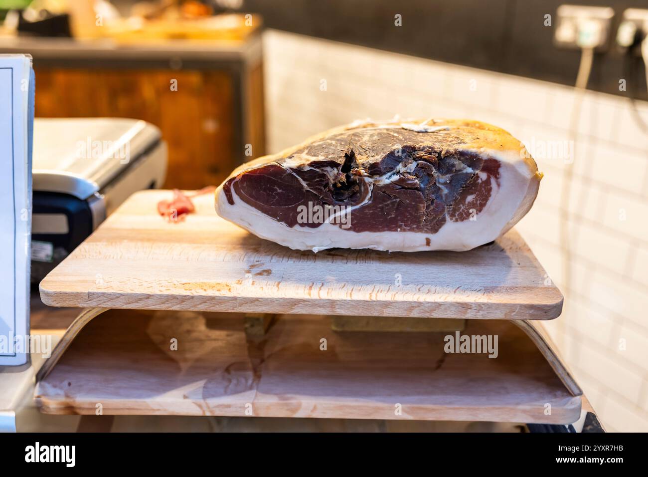 Prosciutto ham for sale on the market lies on the counter Stock Photo ...