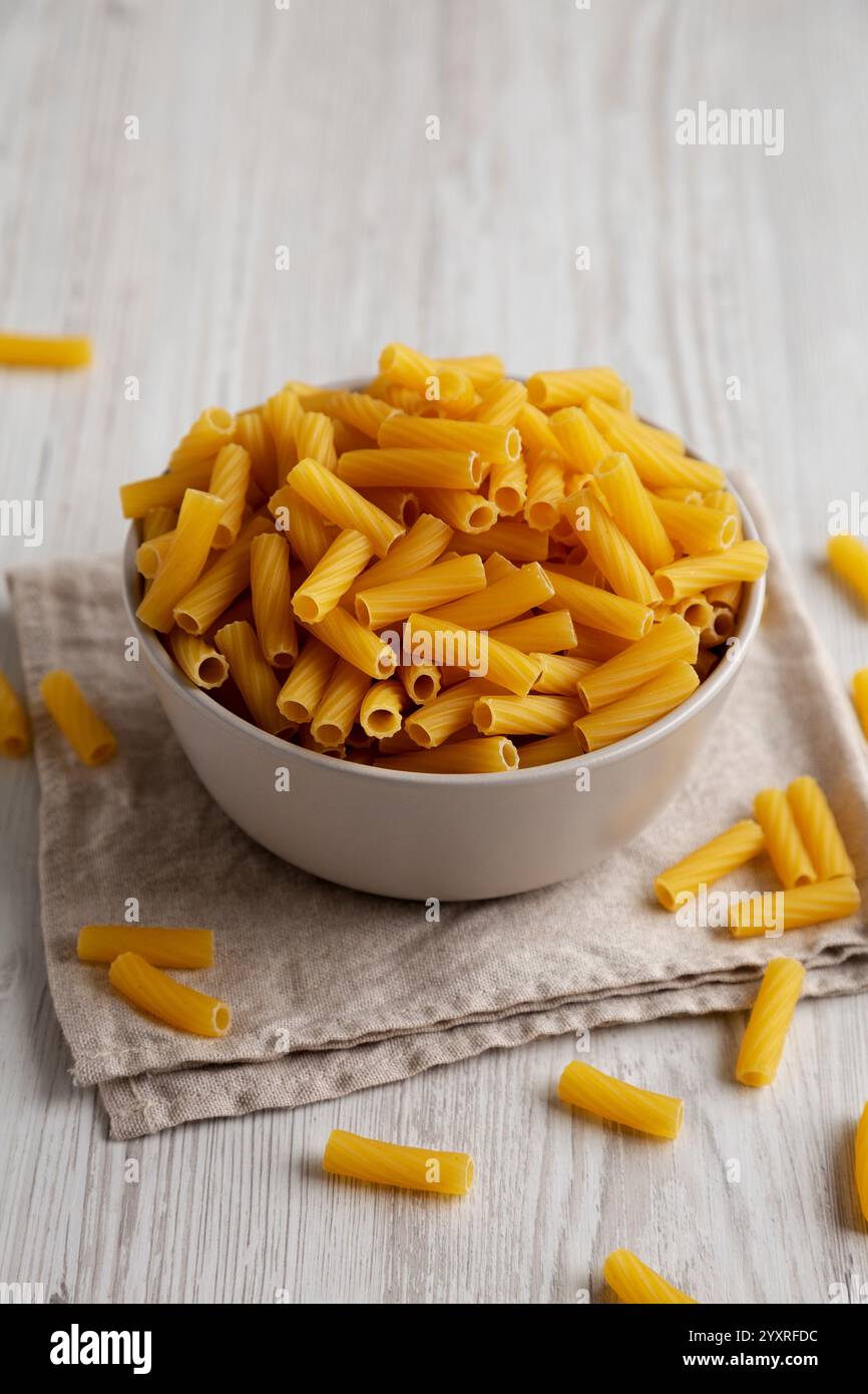 Dry Rigatoni Pasta in a Bowl, side view Stock Photo - Alamy