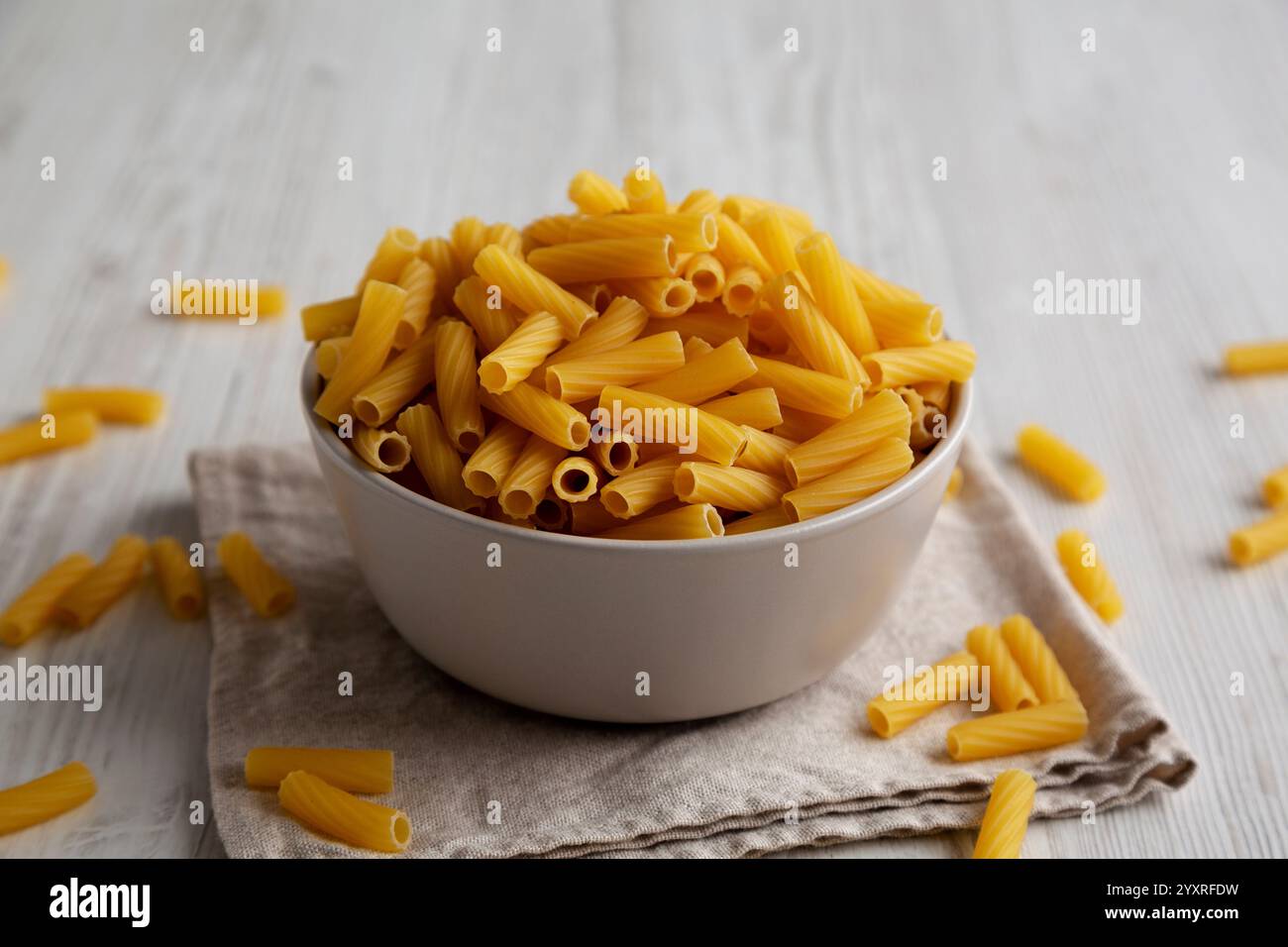 Dry Rigatoni Pasta in a Bowl, side view Stock Photo - Alamy