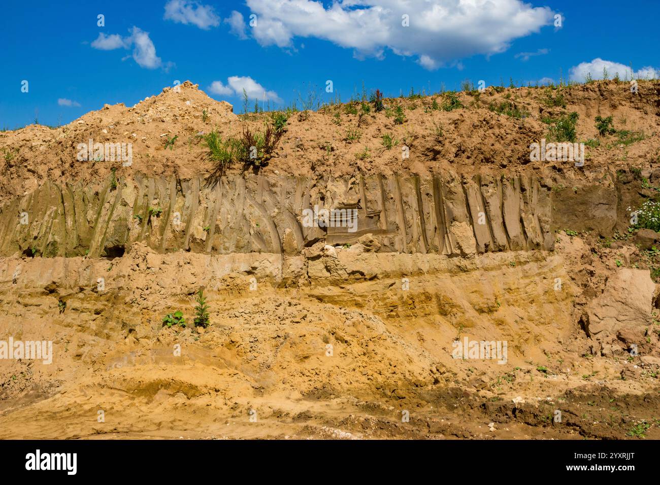 Excavator bucket marks on quarry wall Stock Photo - Alamy