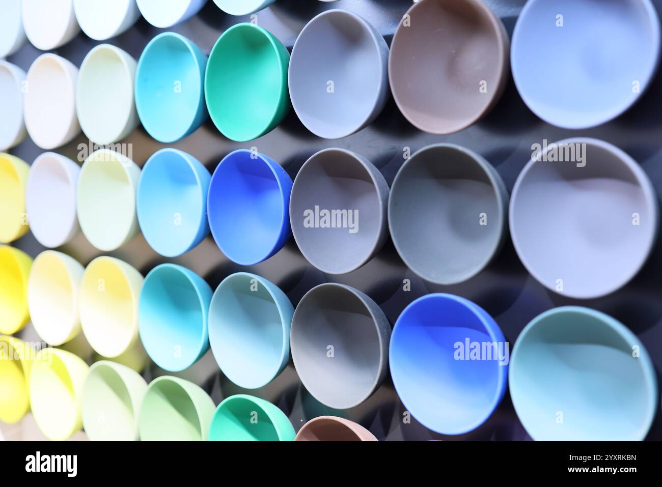 A vibrant and colorful collection of rolled paint samples beautifully ...