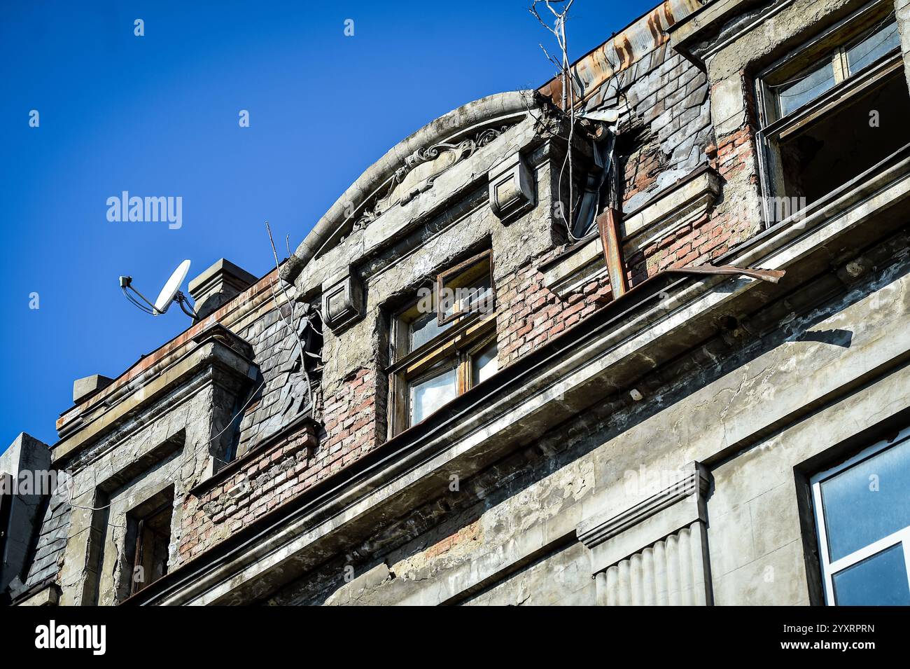Big cracks on the facade of an old building in Bucharest Stock Photo ...