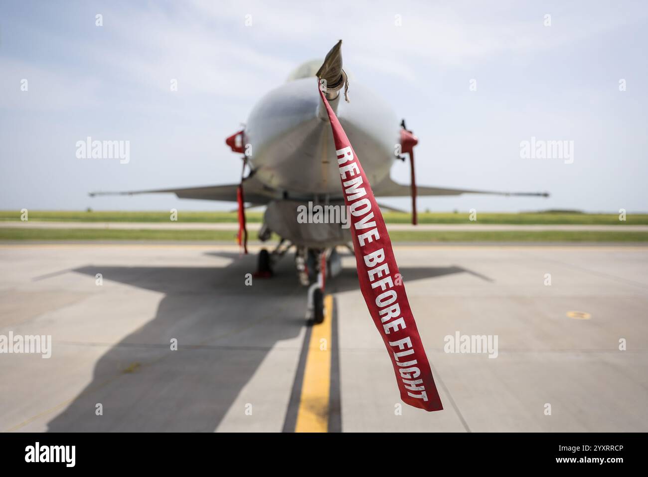 Remove before flight ribbon safety on a fighter jet Stock Photo - Alamy