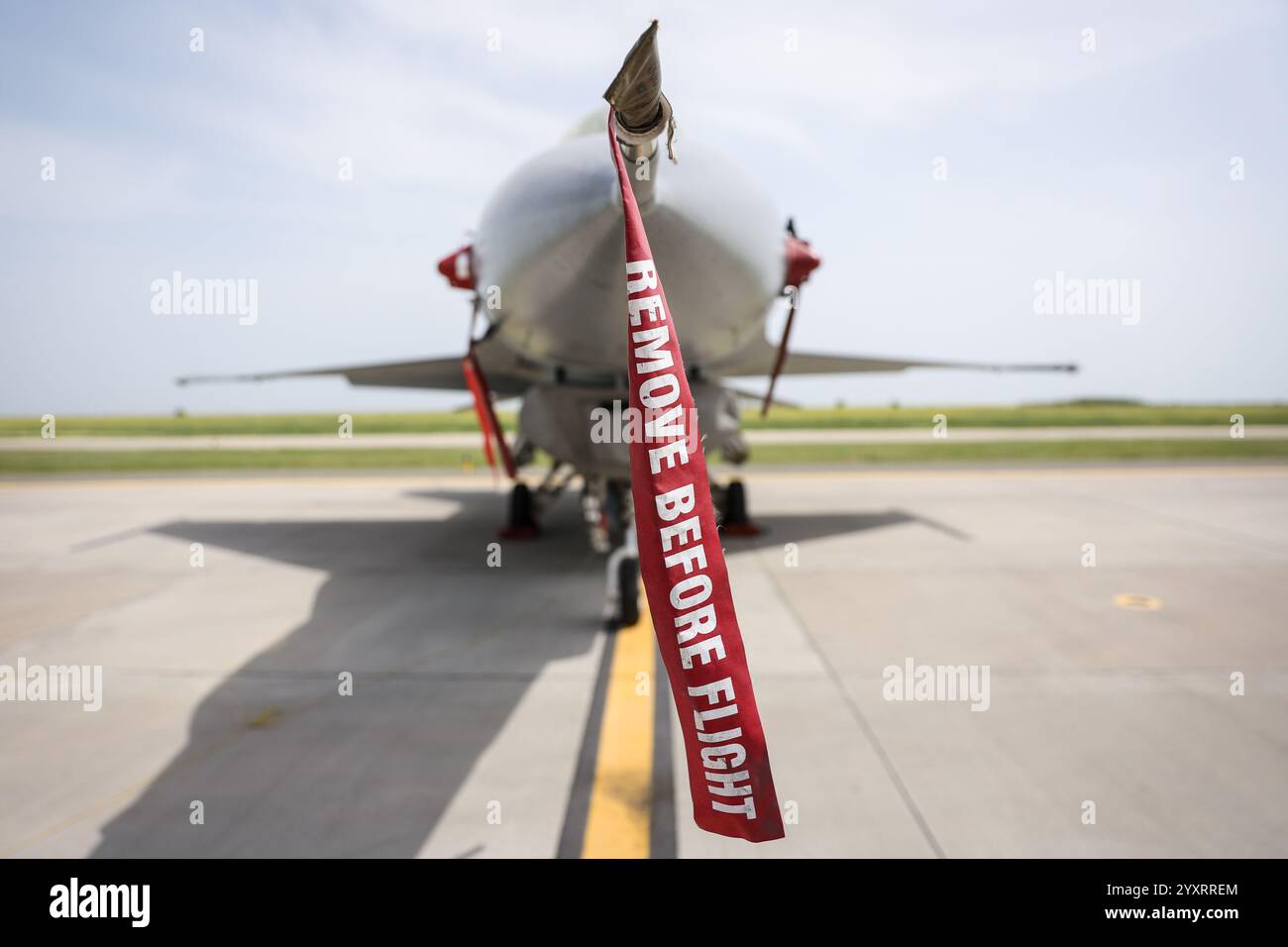 Remove before flight ribbon safety on a fighter jet Stock Photo - Alamy