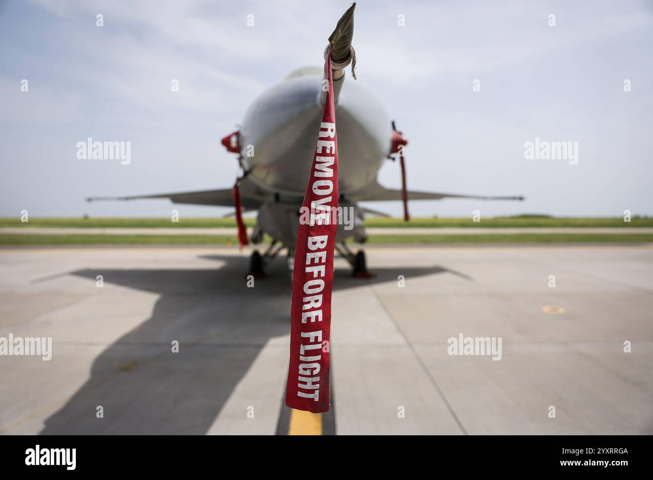 Remove before flight ribbon safety on a fighter jet Stock Photo - Alamy