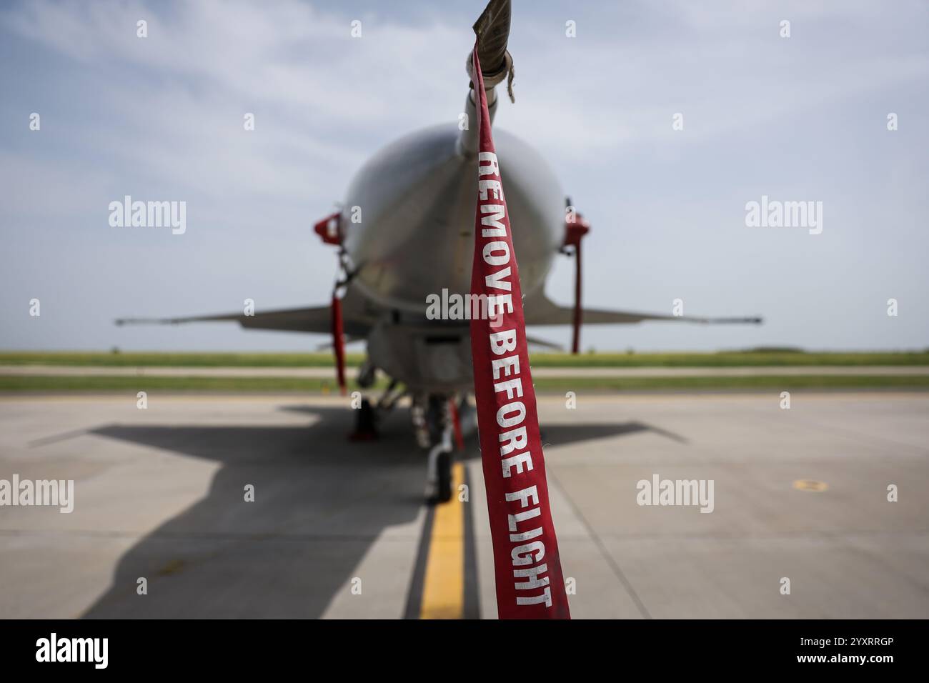 Remove before flight ribbon safety on a fighter jet Stock Photo - Alamy