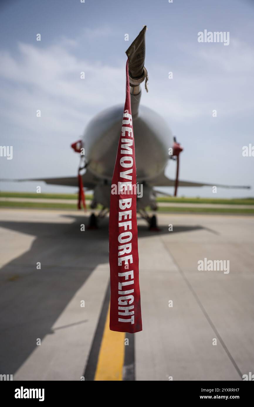 Remove before flight ribbon safety on a fighter jet Stock Photo - Alamy